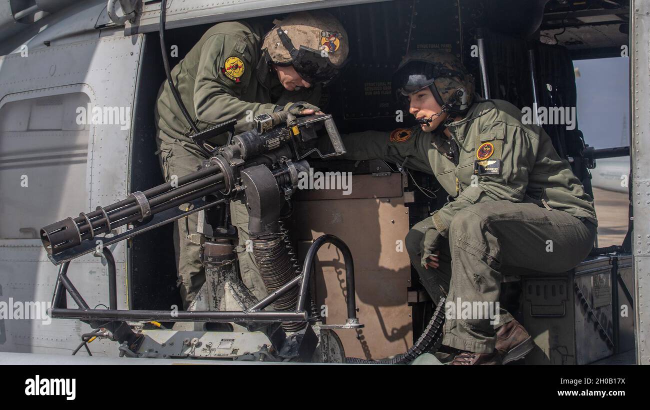 U.S. Marine Corps Gunnery Sgt. Scott Schamber, left, and Cpl. Brooks ...
