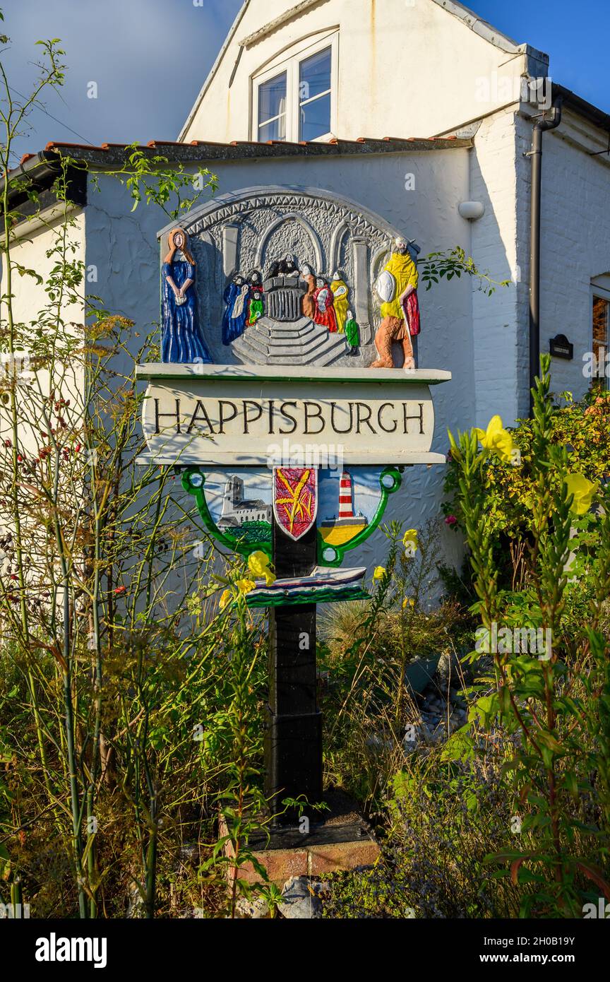 The colourful village sign with woodcarving in Happisburgh, Norfolk ...