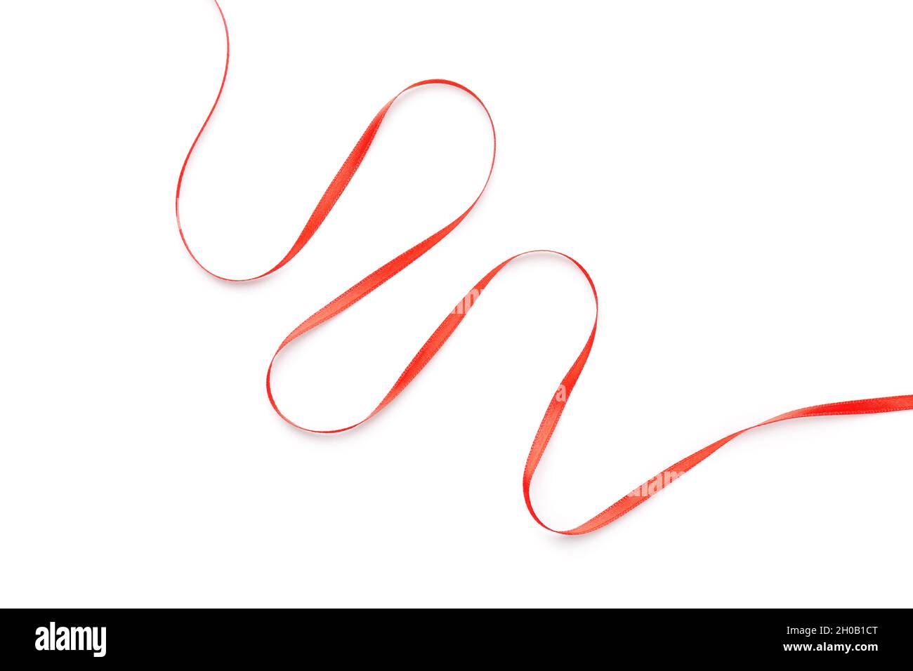 Simple red ribbon on white background, top view Stock Photo - Alamy
