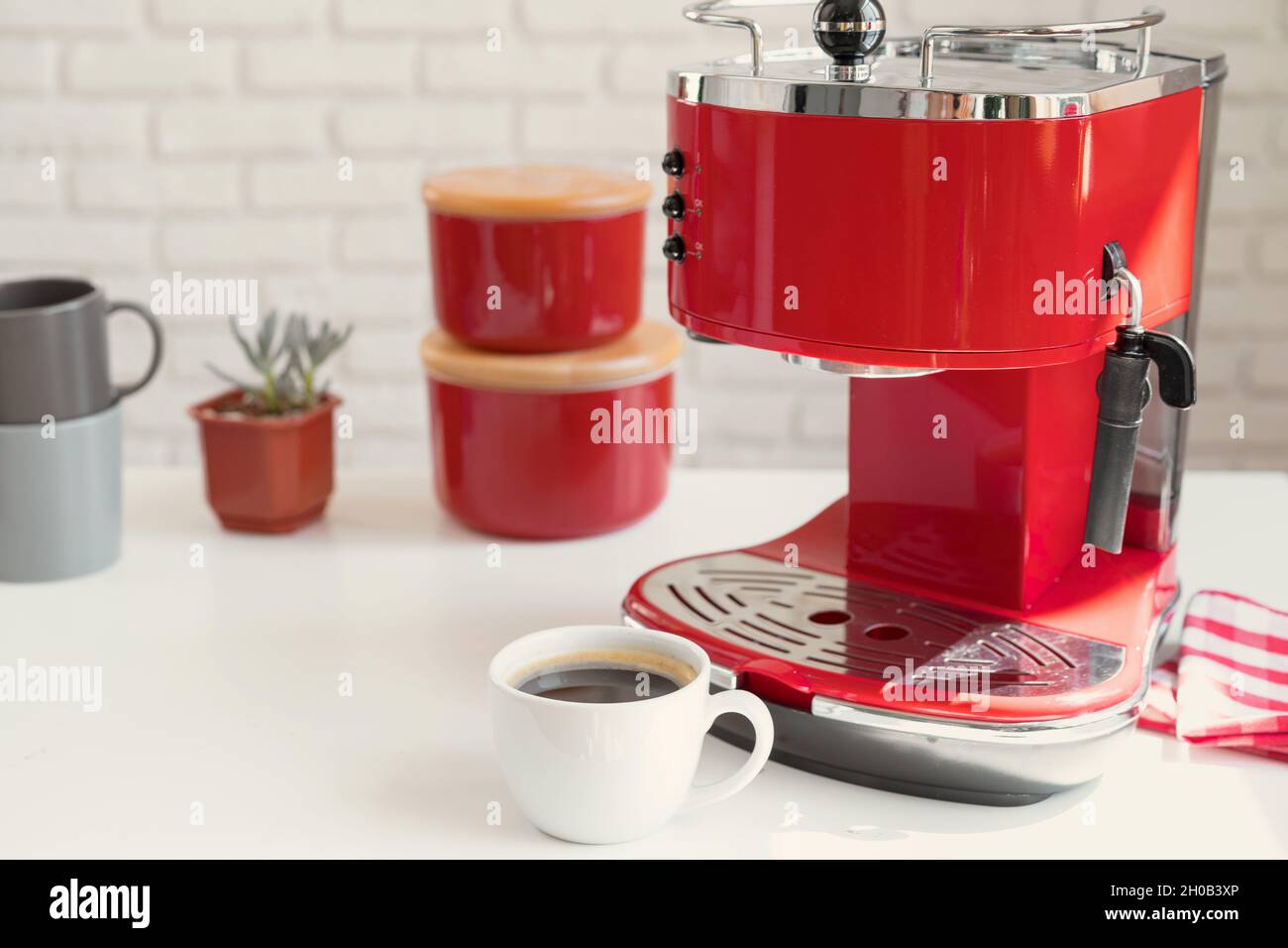 Modern kitchen. Red retro style coffee machine close up Stock Photo - Alamy