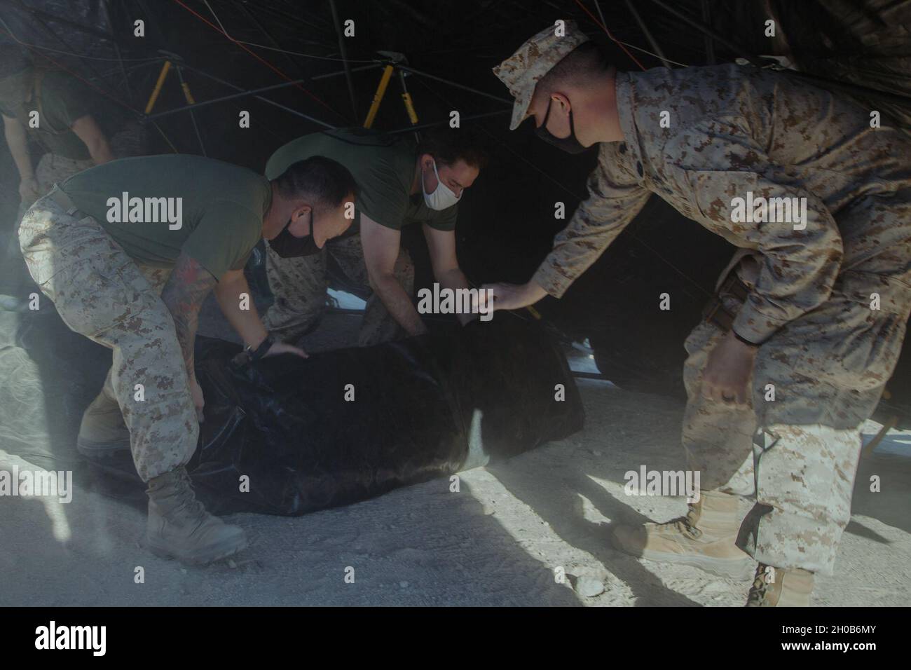 U.S. Marines and U.S. Navy Sailors assemble a forward resuscitative ...