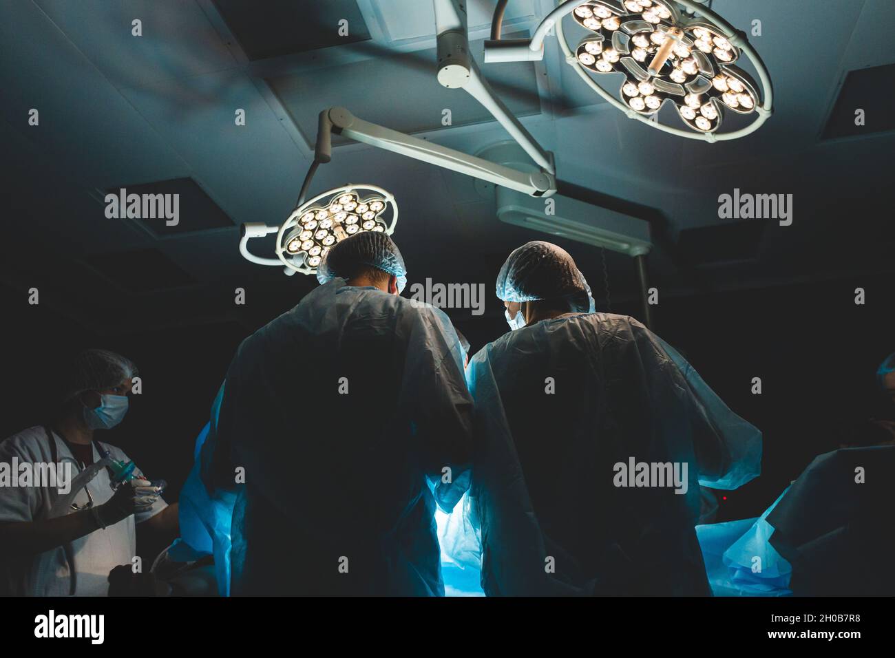 An international professional team of surgeon, assistants and ...