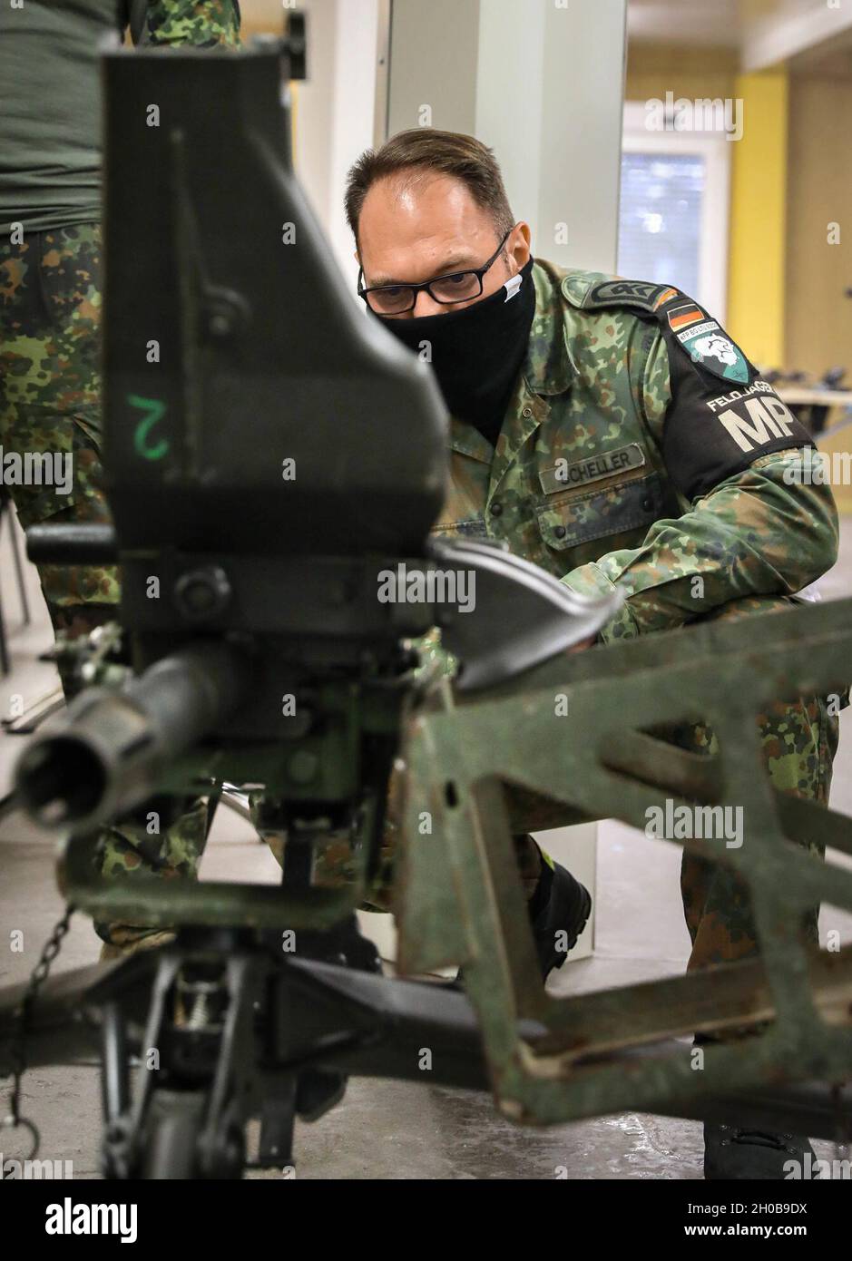 A German Feldjaeger 3 military policeman assigned to NATO-enhanced ...