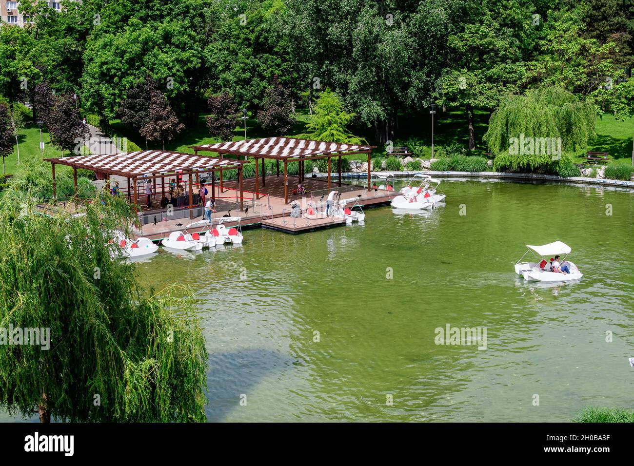 Bucharest, Romania - 29 May 2021: Landscape with lake and vivid green ...