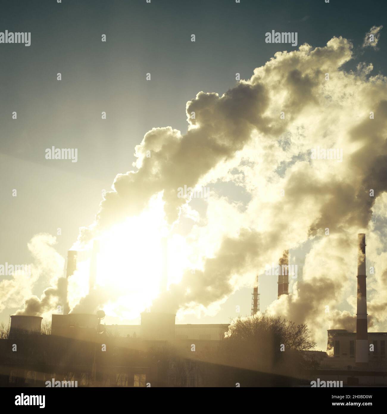Smoke from industrial pipes on a clear sunny day, smog from factory ...