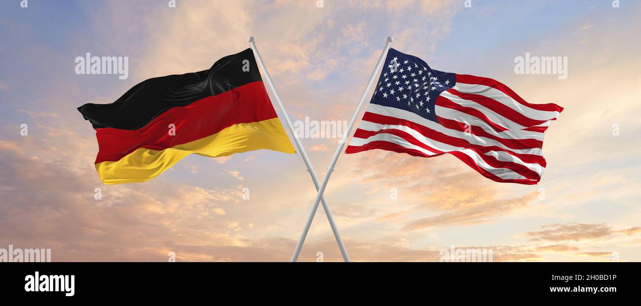 flags of Germany and United States of America waving in the wind on ...