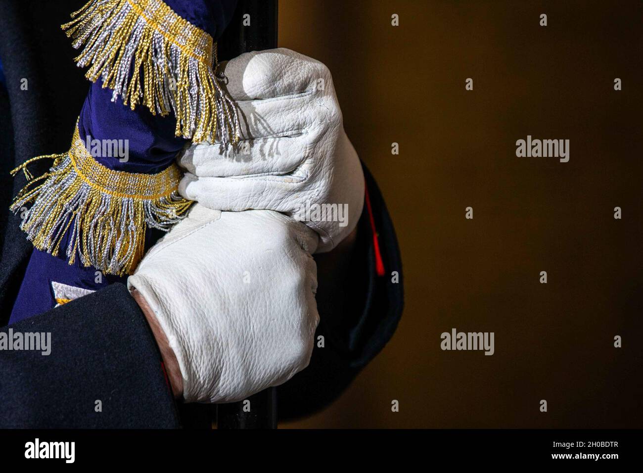 A member of the joint armed forces color guard rehearses during the ...