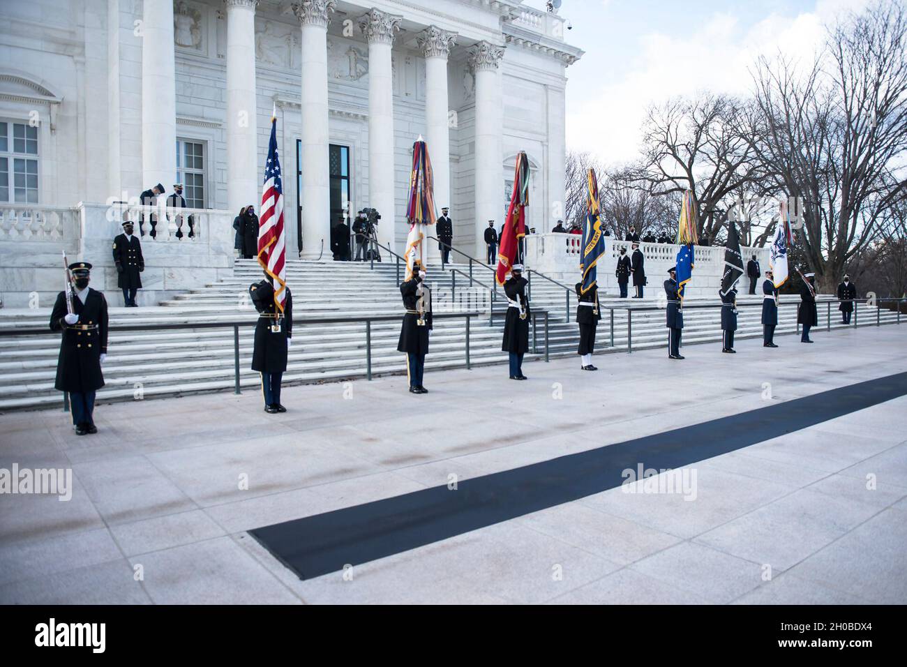 Members of various military honor guards stand at the Tomb of the ...