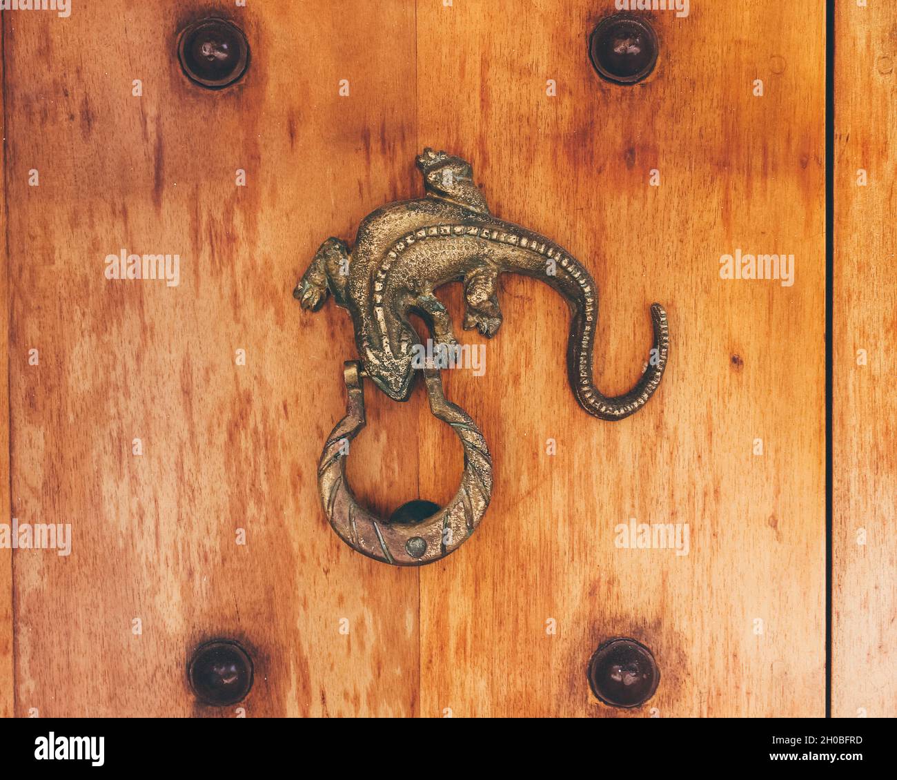 Antique wooden door knocker design Stock Photo - Alamy