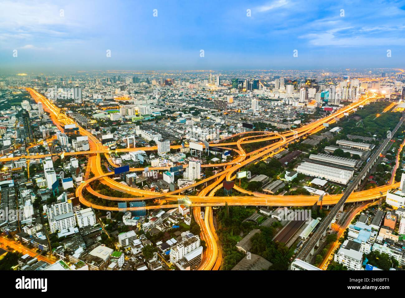 Evening aerial view of highway roads and modern cityscape Stock Photo ...