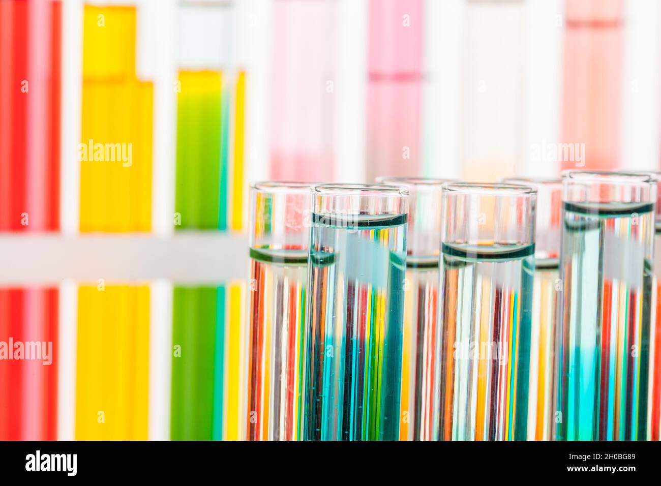 Glass laboratory chemical test tubes with liquid for analysis close up ...