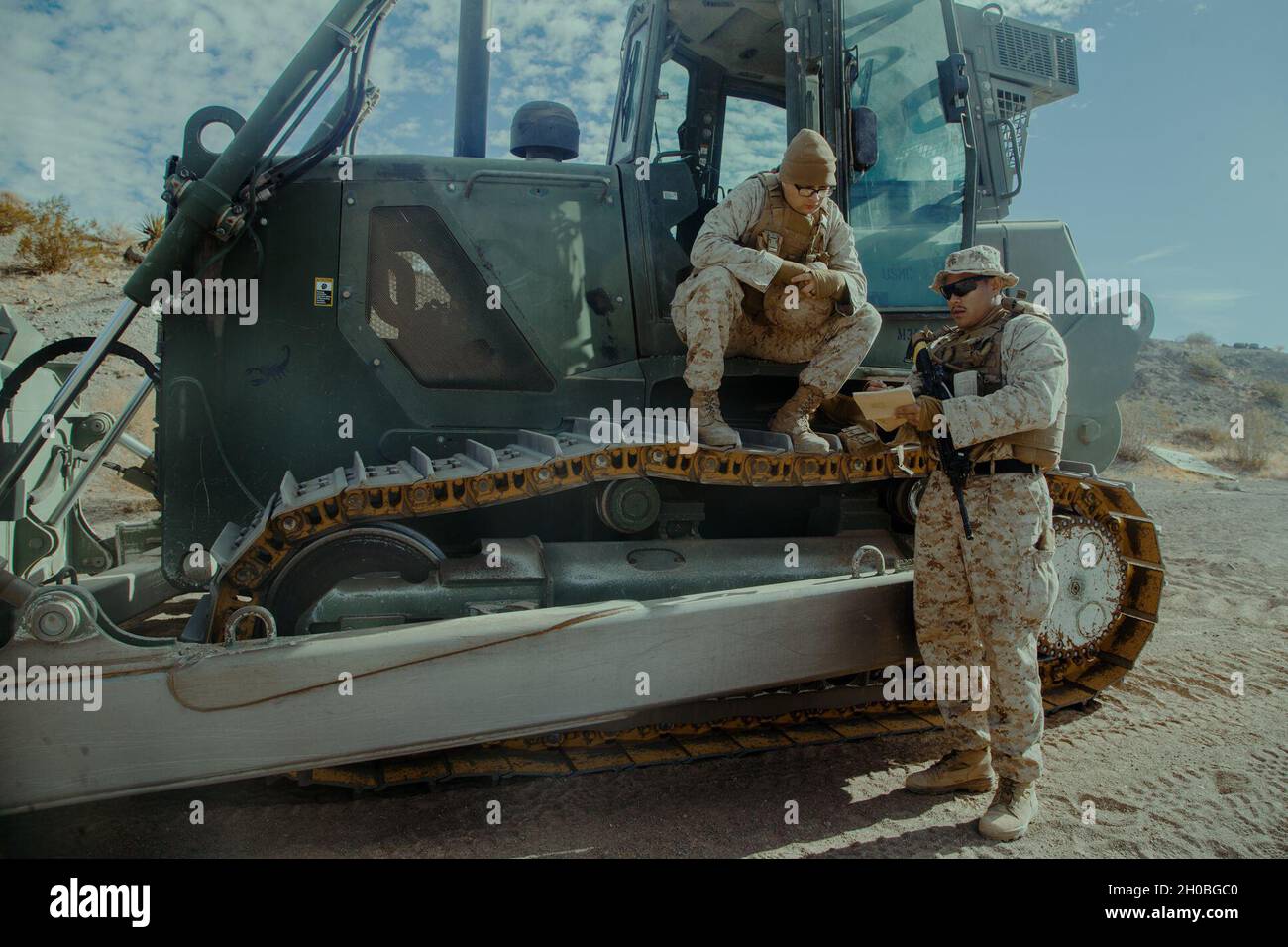 U.S. Marine Corps Lance Cpl. Dakota Parker receives instruction during ...