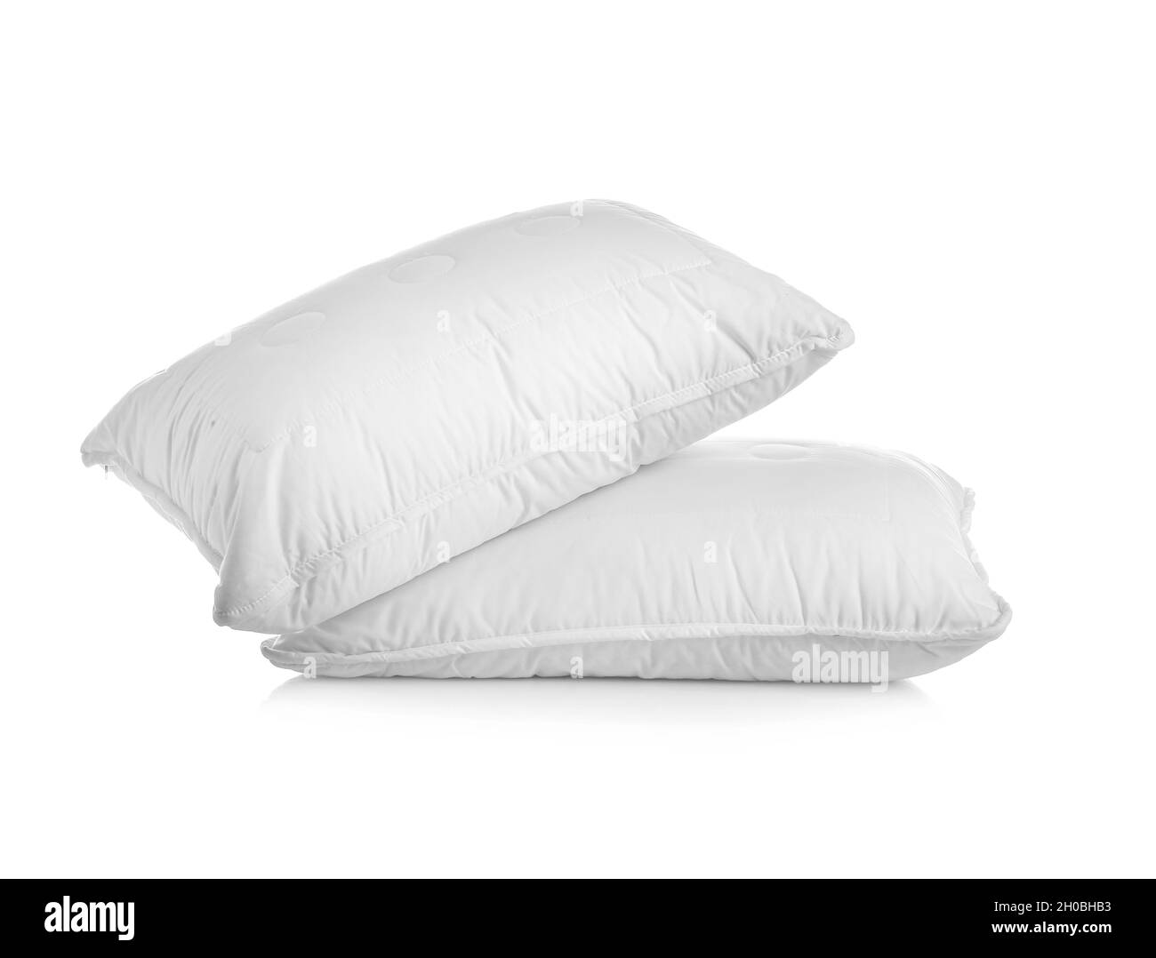 Clean soft bed pillows on white background Stock Photo - Alamy