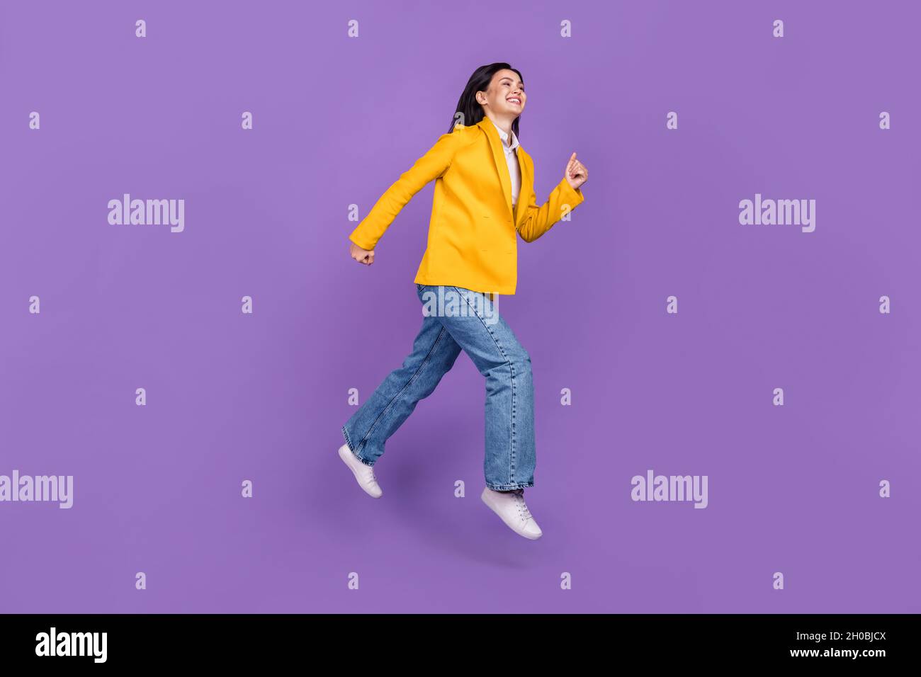 Full size photo of excited cool happy businesswoman jump go empty space ...