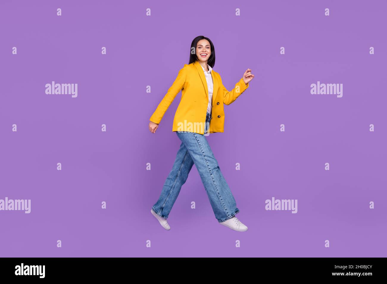 Full body photo of cheerful happy businesswoman jump up go empty space ...
