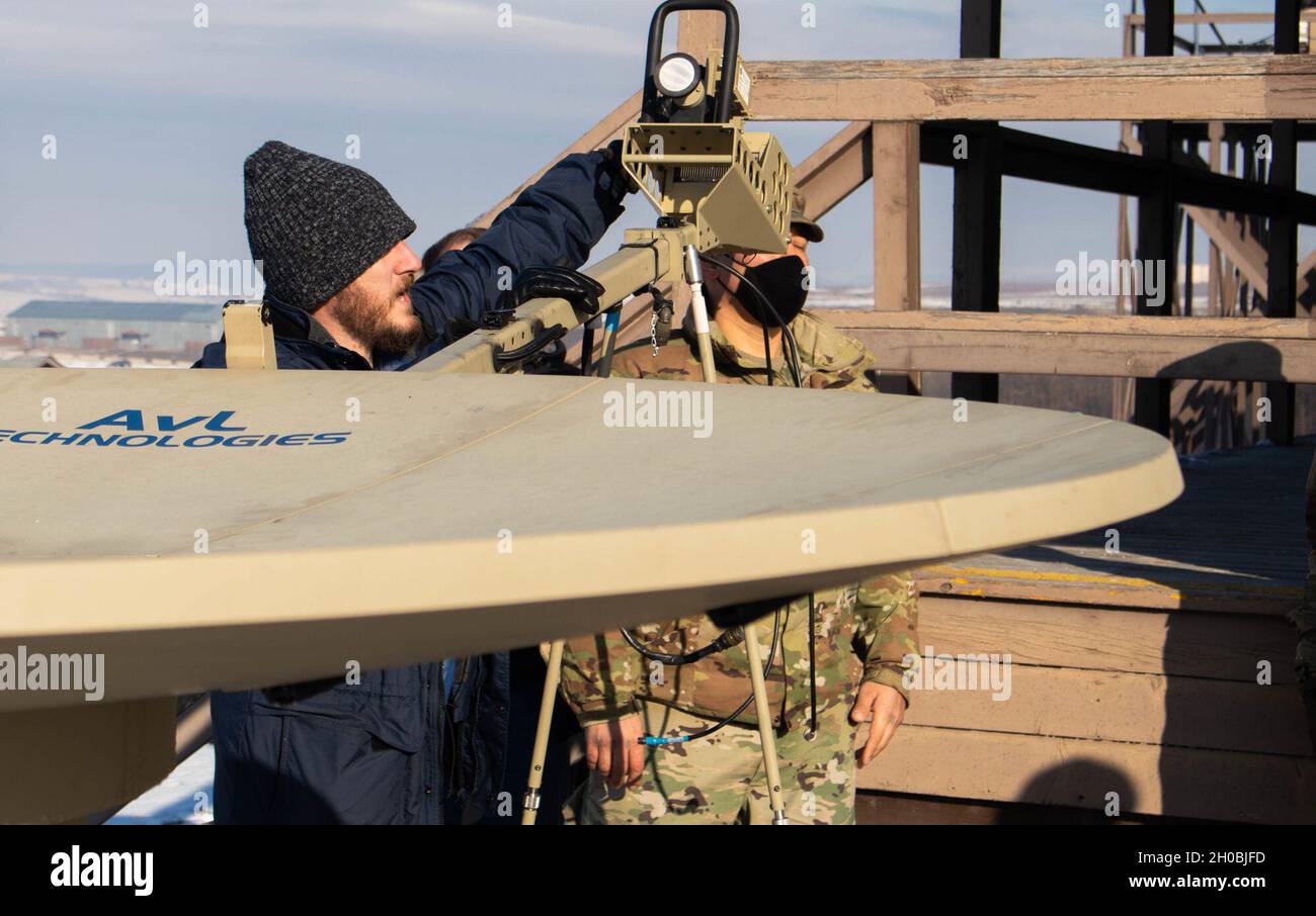 Walter Plucinski, a contractor with Comtech Telecommunications, teaches ...