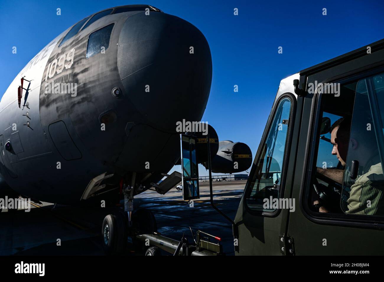 Senior Airman Zach Smith, 911th Maintenance Squadron crew chief, tows a ...