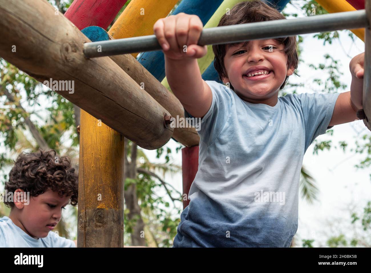 Hispanic child playing in the playground Stock Photo - Alamy