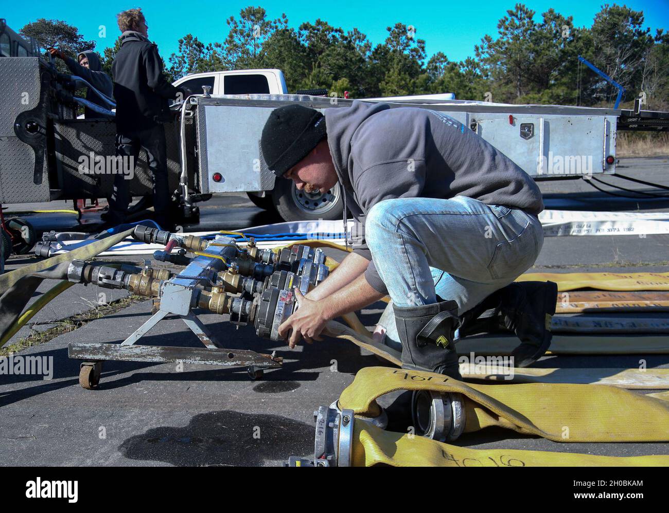 Jacob Wallace, a hose technician, prepares to test a Down East Fire ...