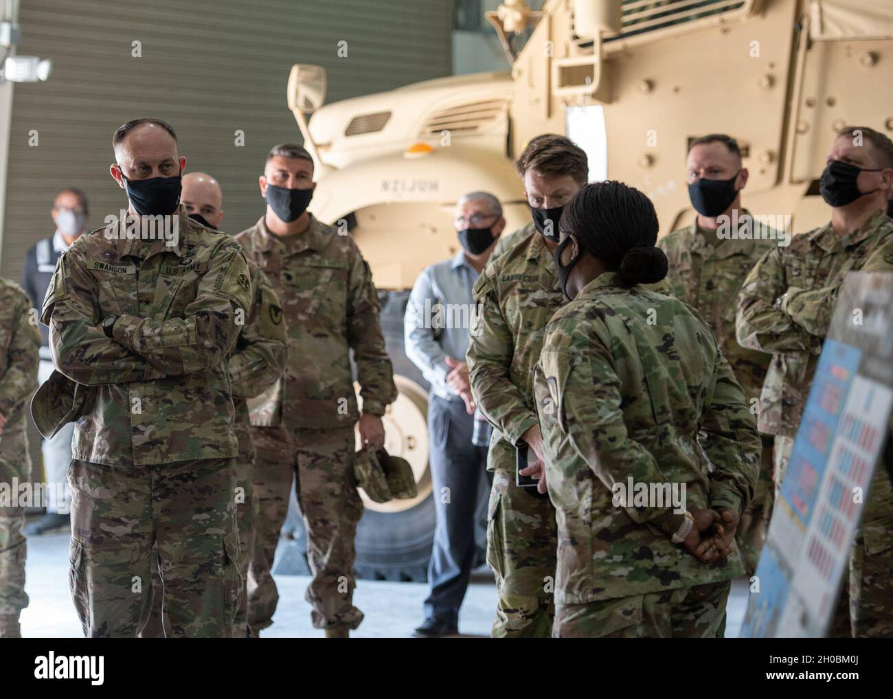 Surrounded by MRAPs and 401st Army Field Support Brigade personnel ...