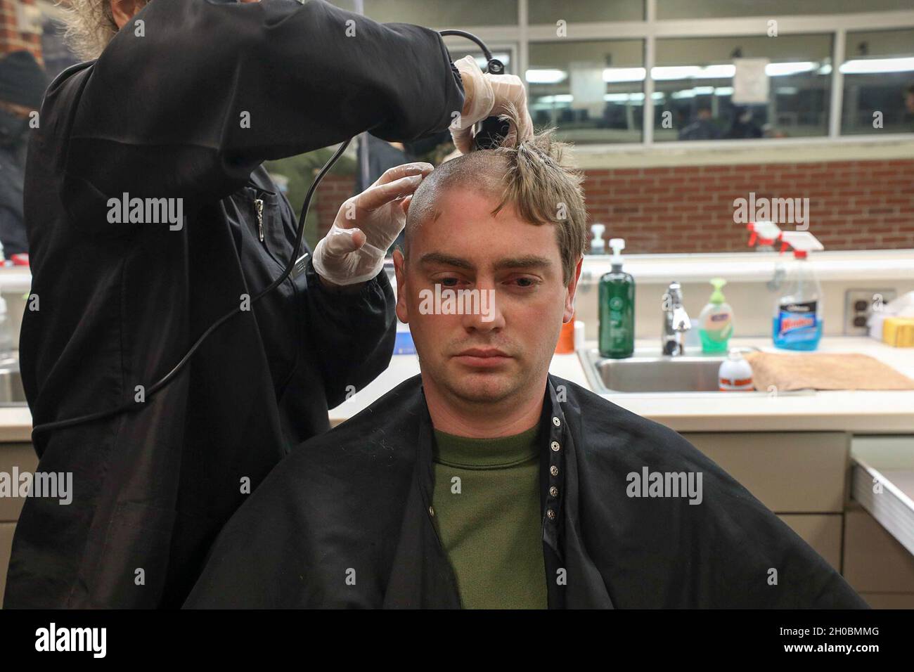 A recruit with Kilo Company, 3rd Recruit Training Battalion, has his ...