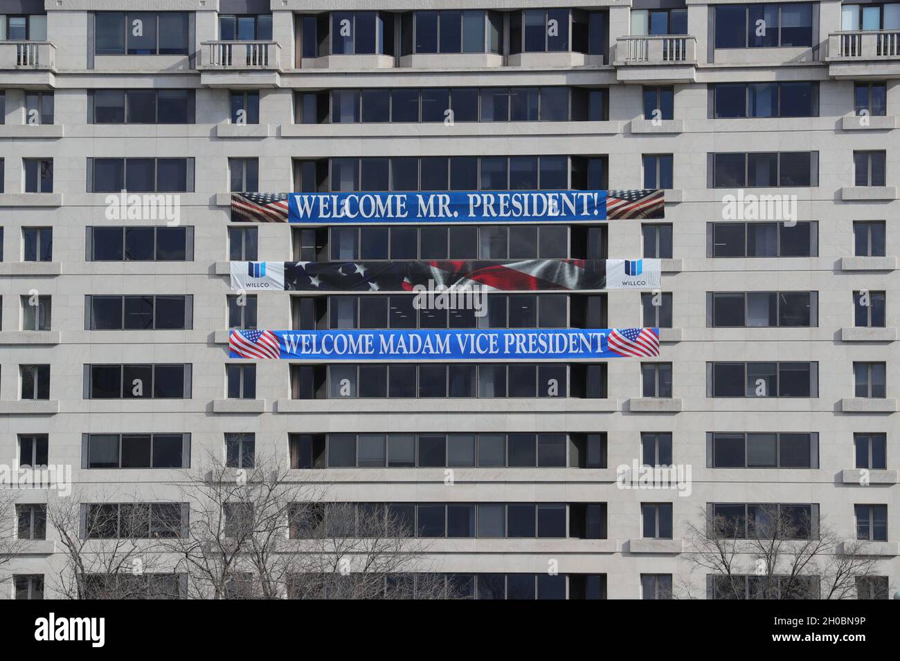 Banners hang from a building welcoming the incoming President Joseph R ...