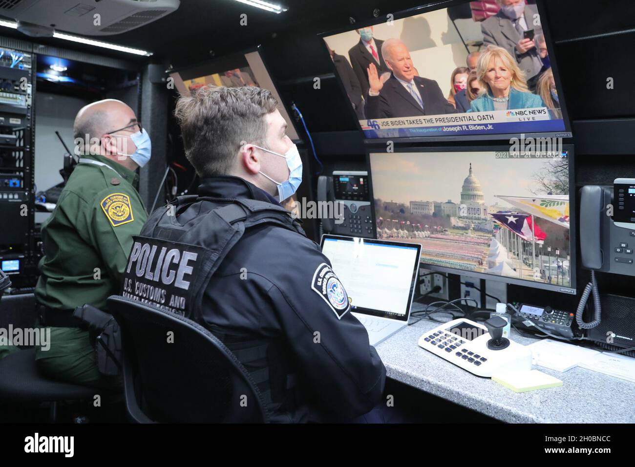 U.S. Customs and Border Protection officers and agents observe ...