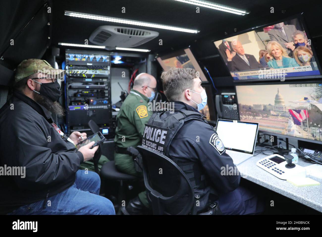 U.S. Customs and Border Protection officers and agents observe ...