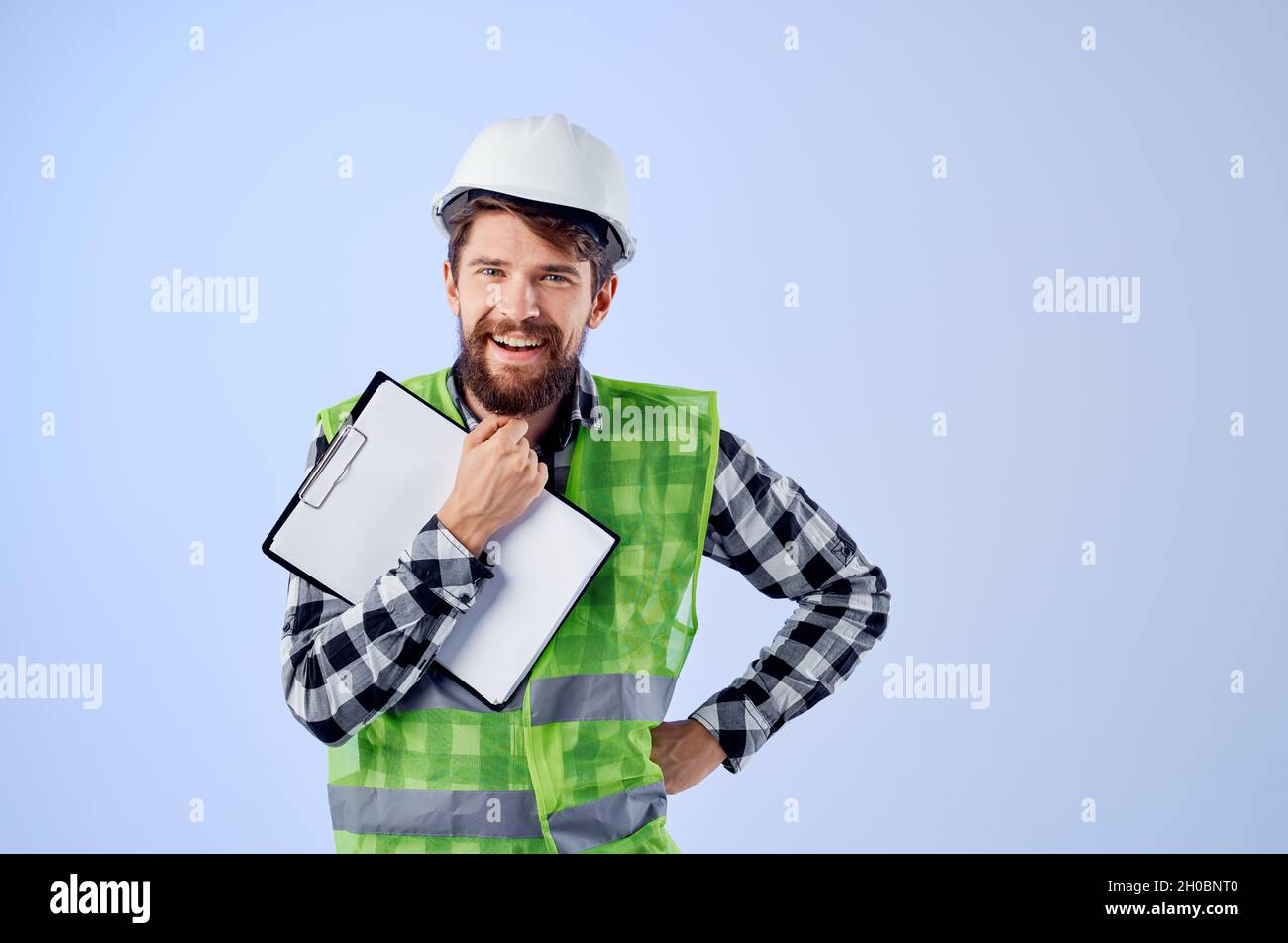 engineer with documents and drawings blueprints blue background Stock ...