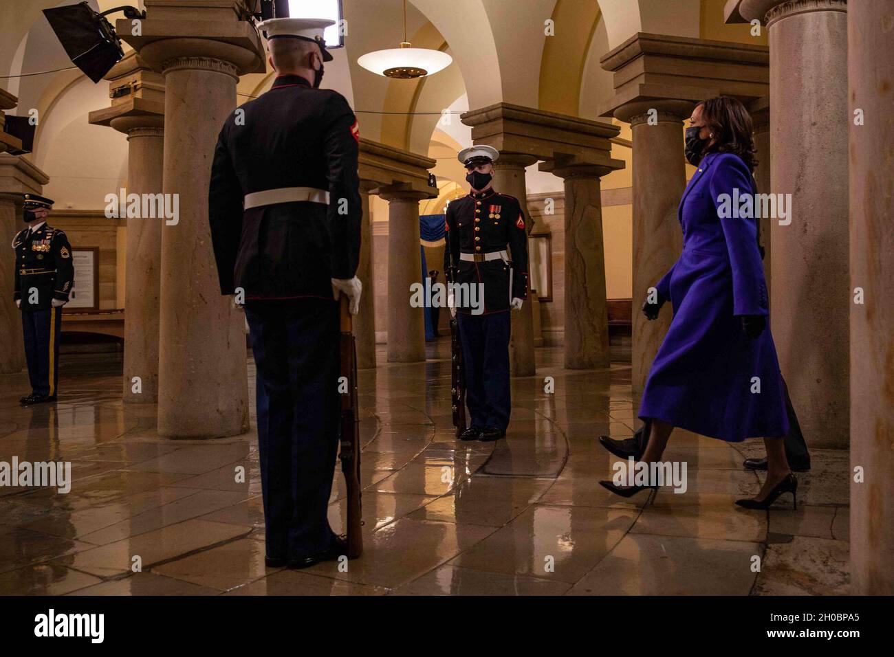 Vice-President-elect Kamala Harris moves into position during the ...
