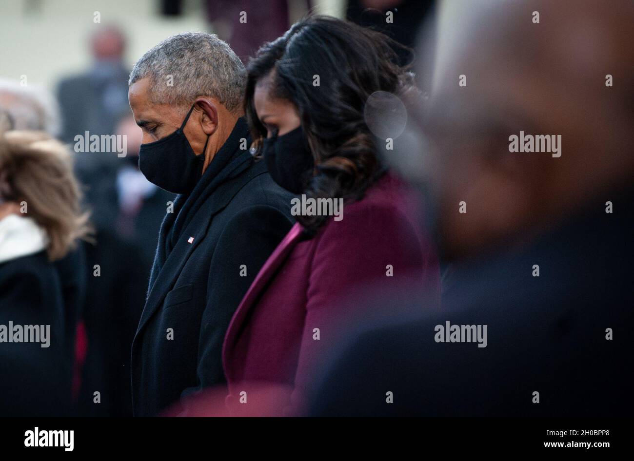 Former President Barack Obama and former first lady Michelle Obama bow ...