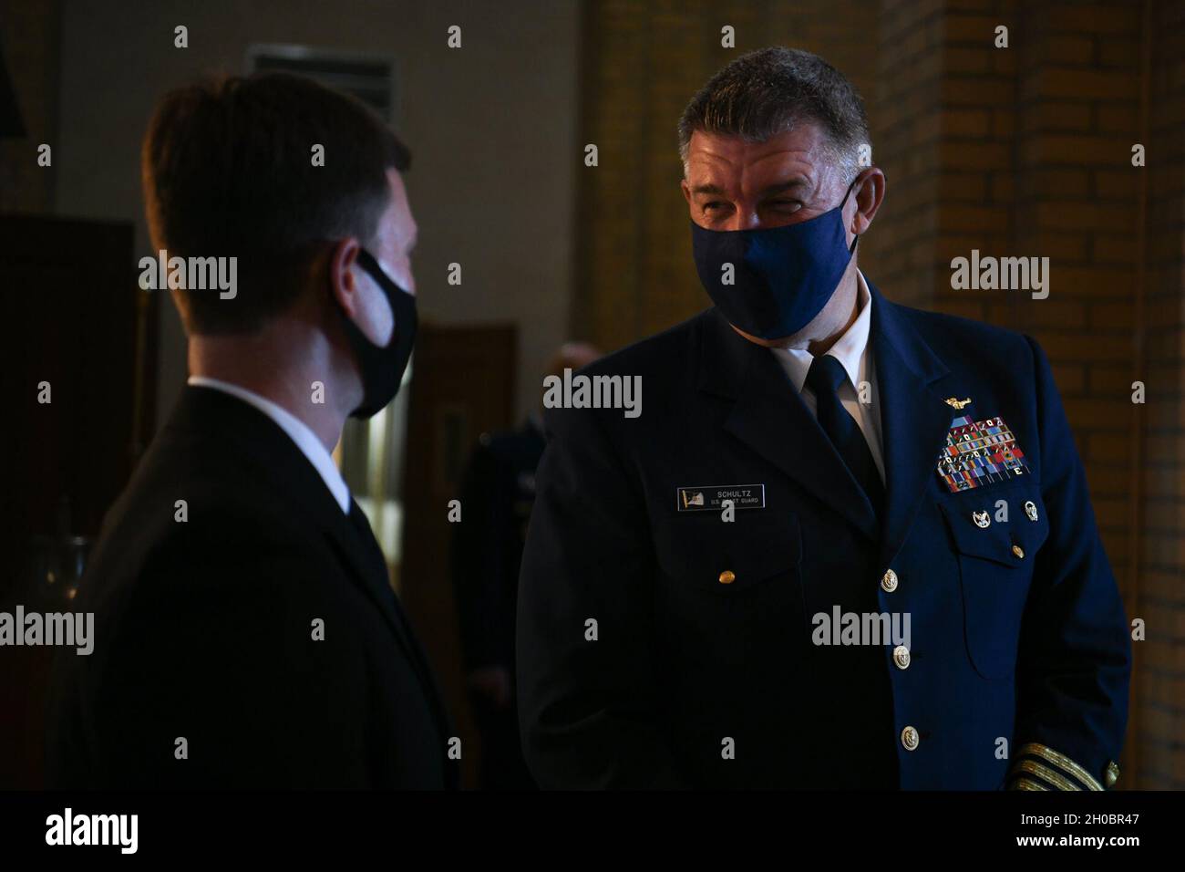 Commandant of the U.S. Coast Guard Admiral Karl Schultz converses with ...
