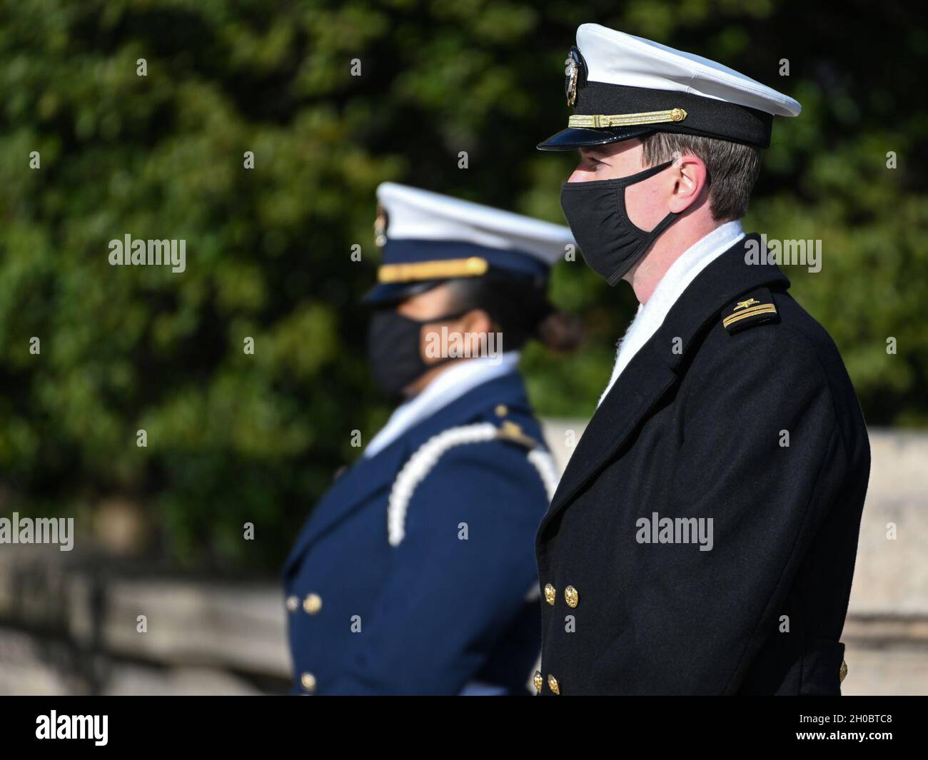 A member of the U.S. Navy Ceremonial Guard and a member of the U.S ...