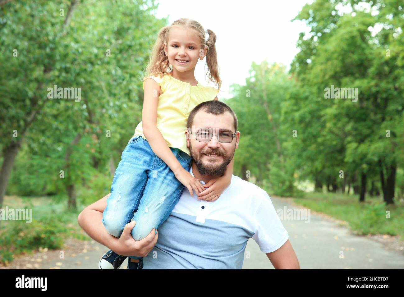 Father with his child outdoors. Happy family Stock Photo - Alamy