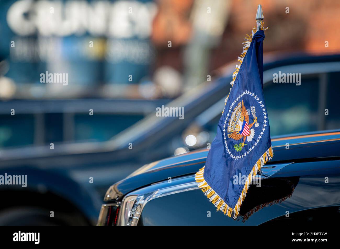 The flag of the President of the United States sits on a vehicle in the ...