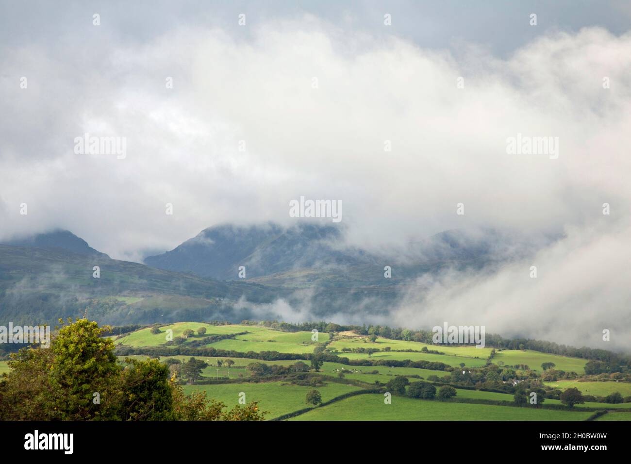 Storm clouds passing across the mountains of the Conwy Valley on a ...