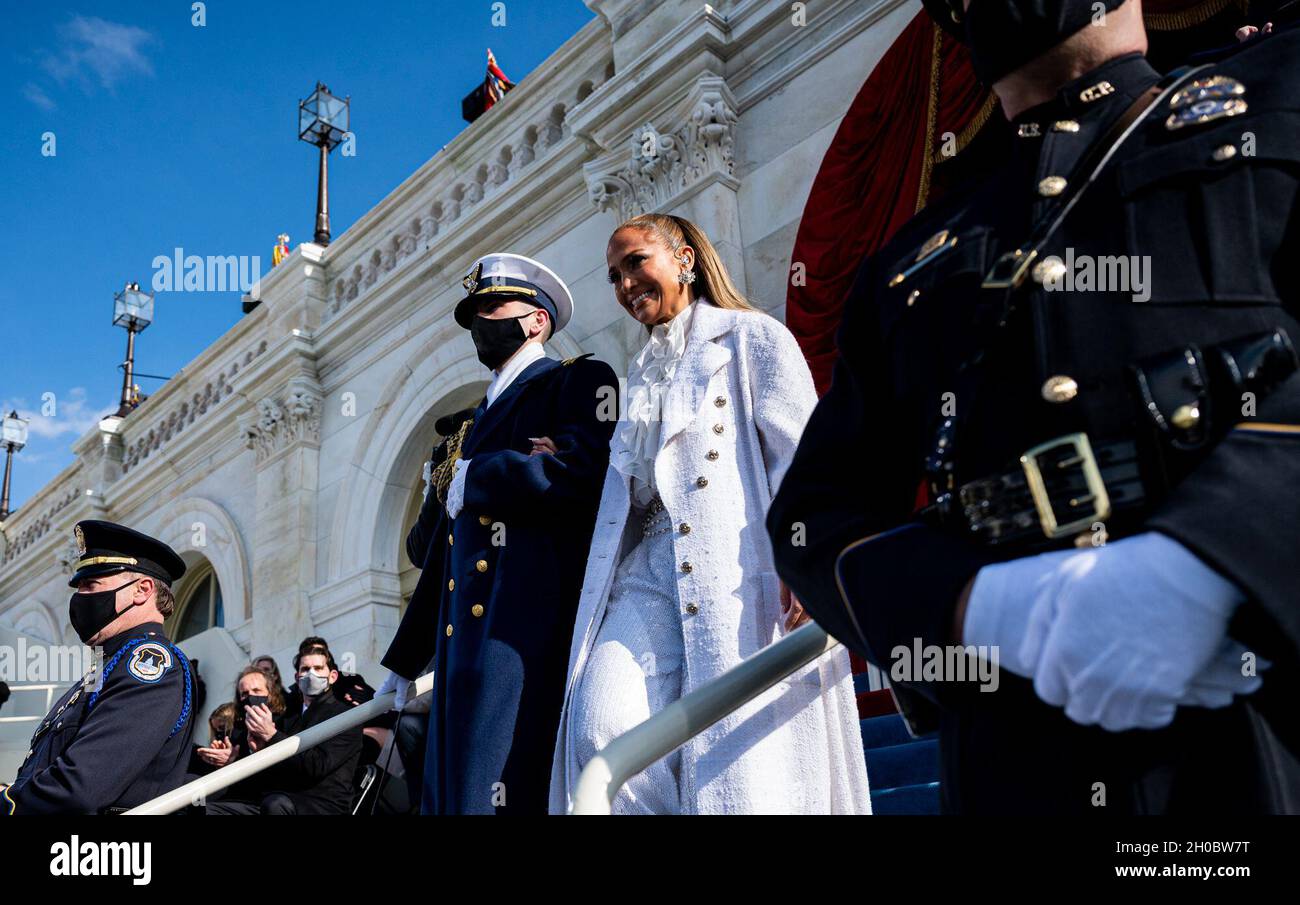 Jennifer Lopez is escorted to perform during the 59th Presidential ...
