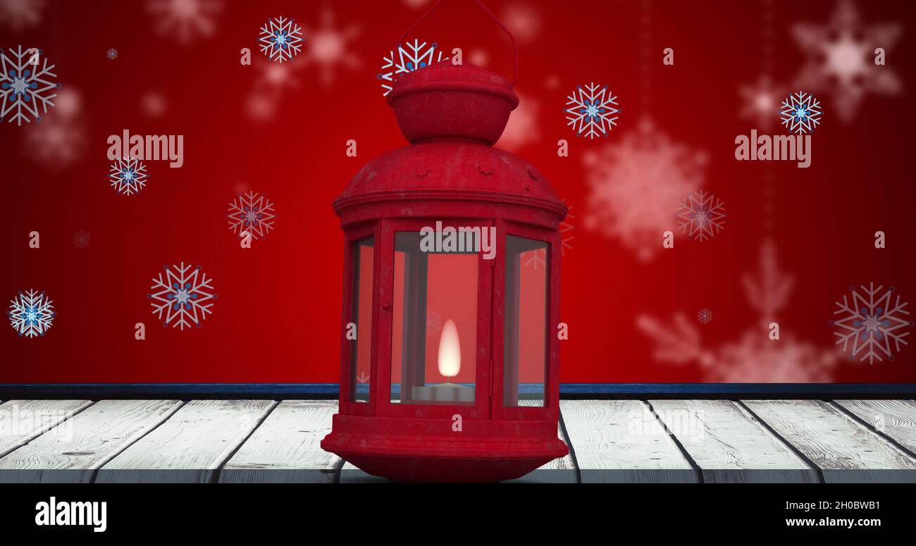Image of snowflakes falling over christmas red lantern Stock Photo - Alamy