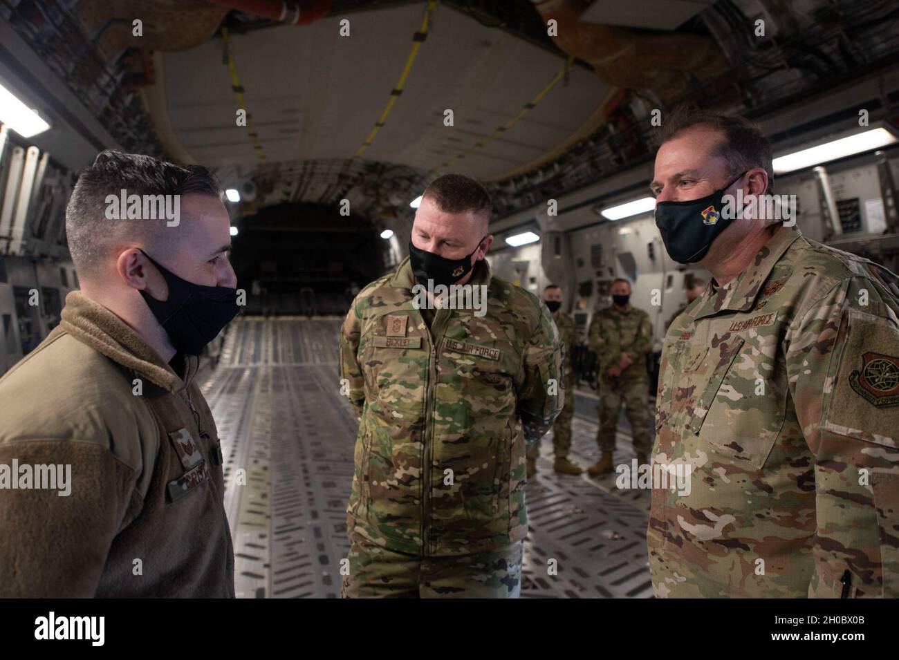 U.S. Air Force Staff Sgt. Nathan Crist, left, 6th Airlift Squadron ...