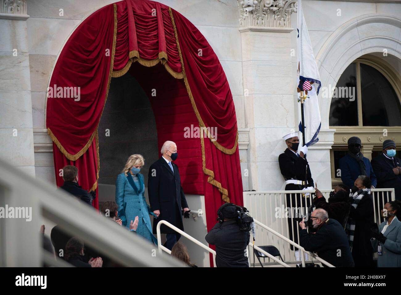 President Joe Biden and his wife Dr. Jill Biden enter the inauguration ...