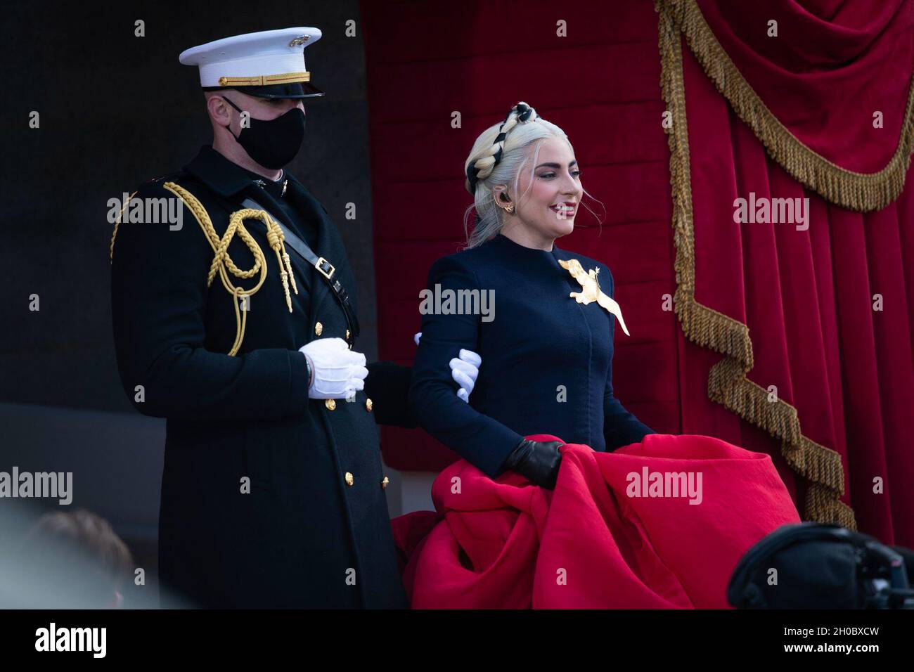 Lady Gaga enters the inauguration platform as she prepares to sing a ...