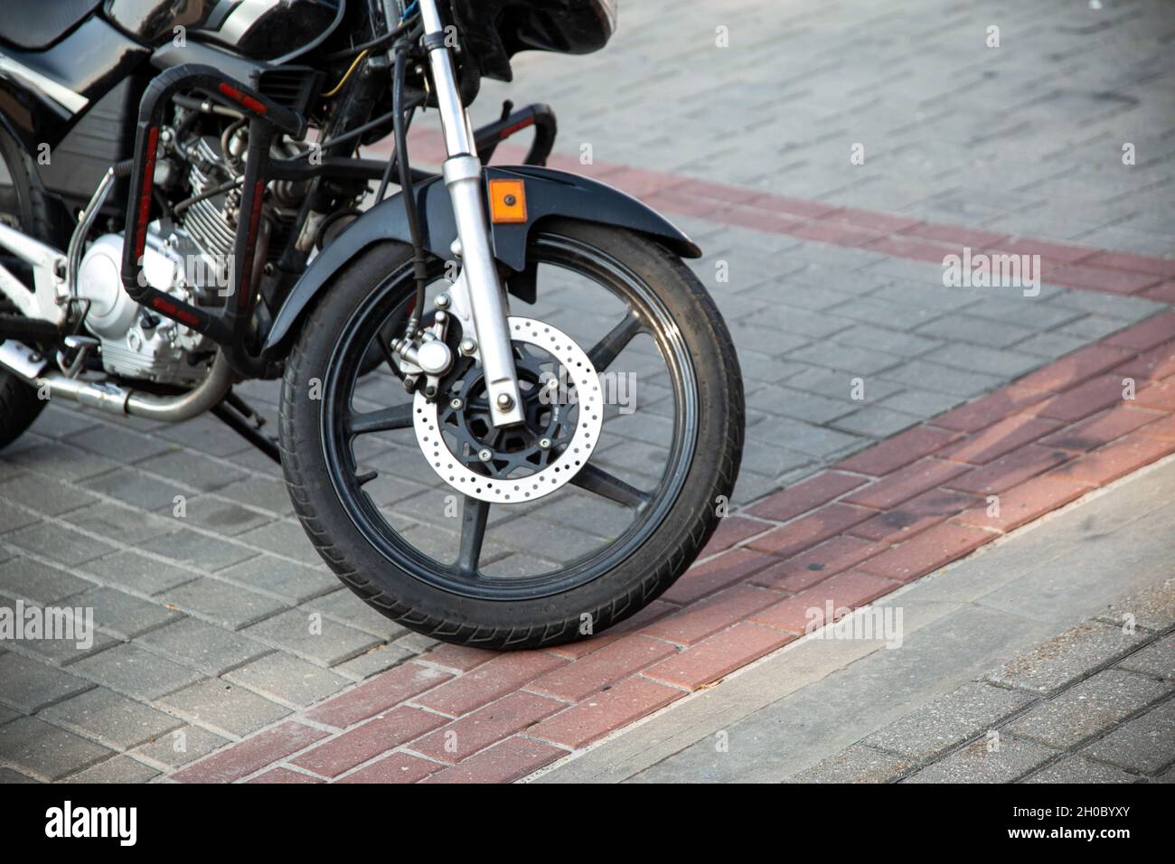 Front wheel with disc brake of a tourist motorcycle in the city Stock ...