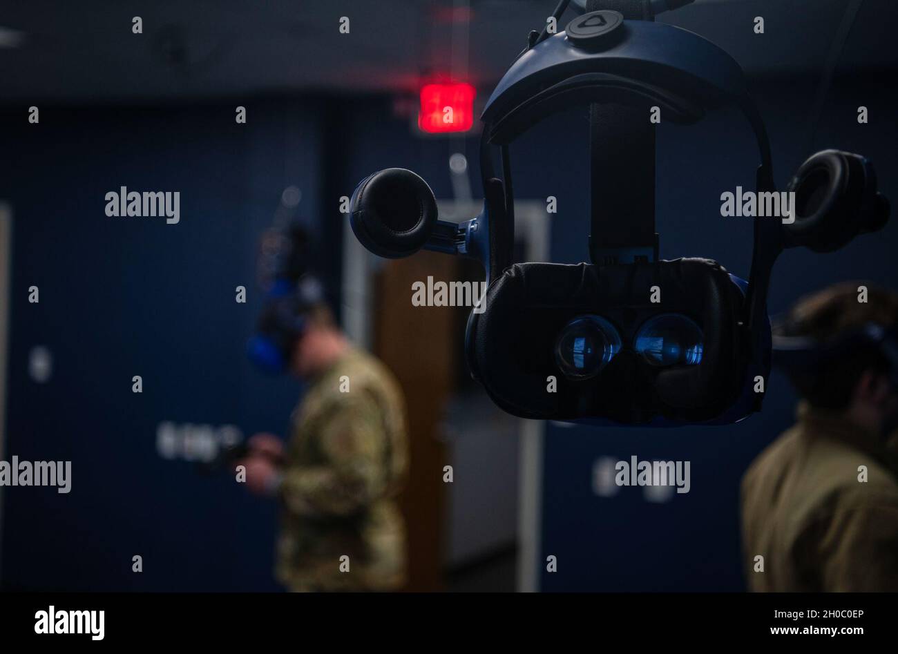 A virtual reality headset hangs from the ceiling in the 317th ...