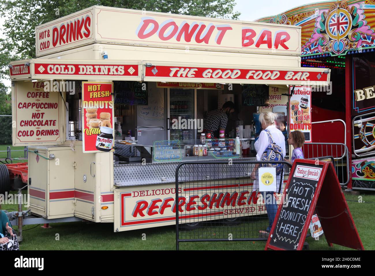 Customers at Donut bar selling hot fresh doughnuts at refreshments ...