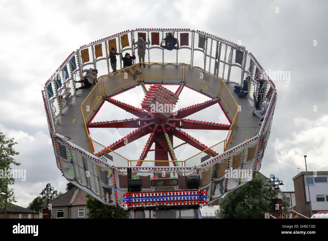 Children messing about on gravity ride at Leatherhead fun fair July ...