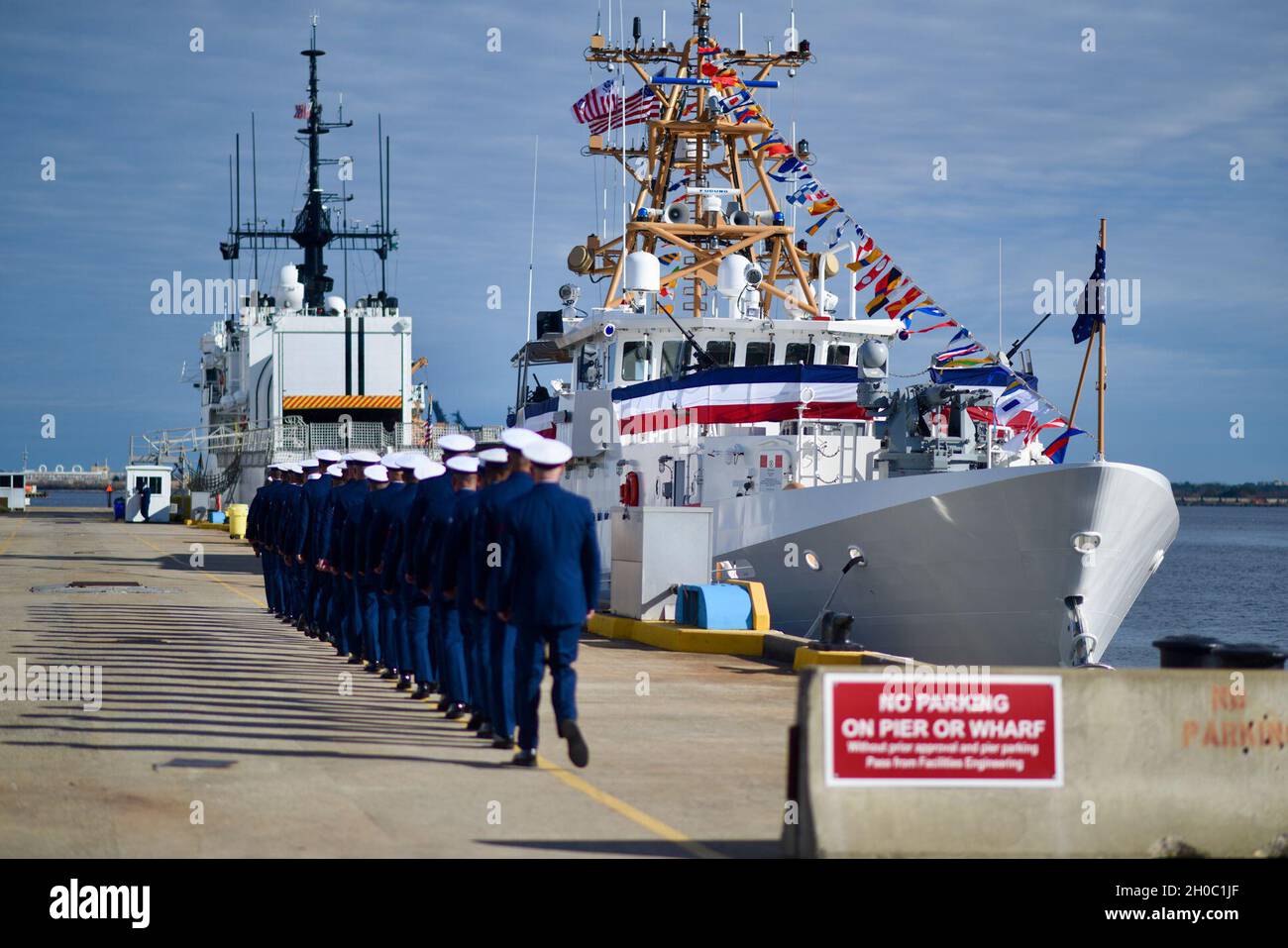 The crew of USCGC Charles Moulthrope (WPC 1141) prepare to bring the ...