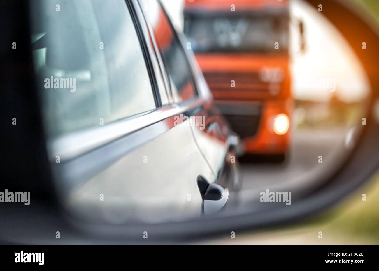 a lorry in the rear-view mirror of a passenger car does not maintain a ...