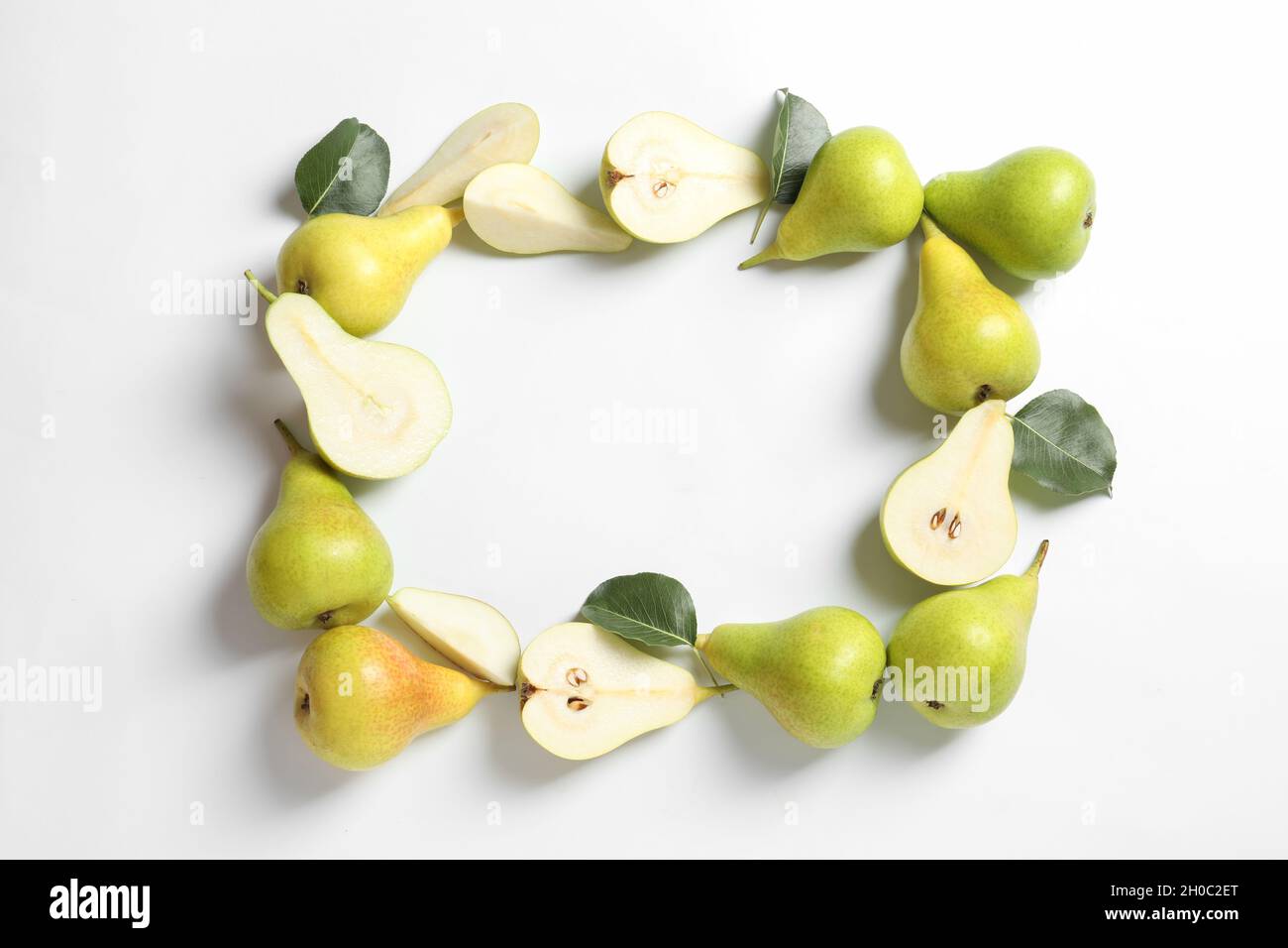 Frame made of pears on white background, top view Stock Photo - Alamy