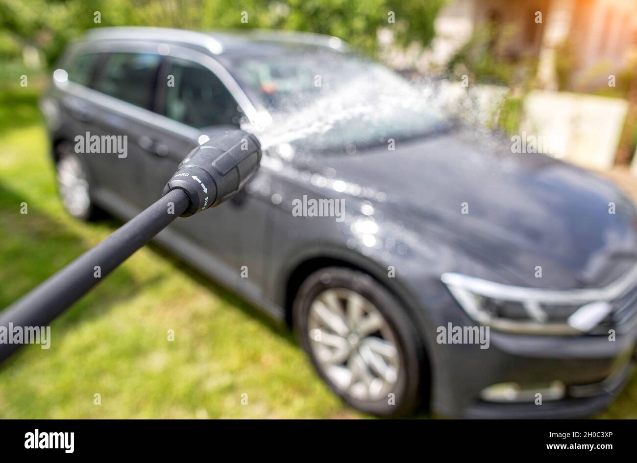 Car wash with modern car shampoo using a high pressure washer in summer ...