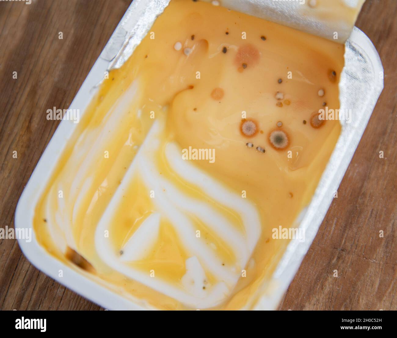 Spoiled cheese with mold and mildew. Violation of food storage ...